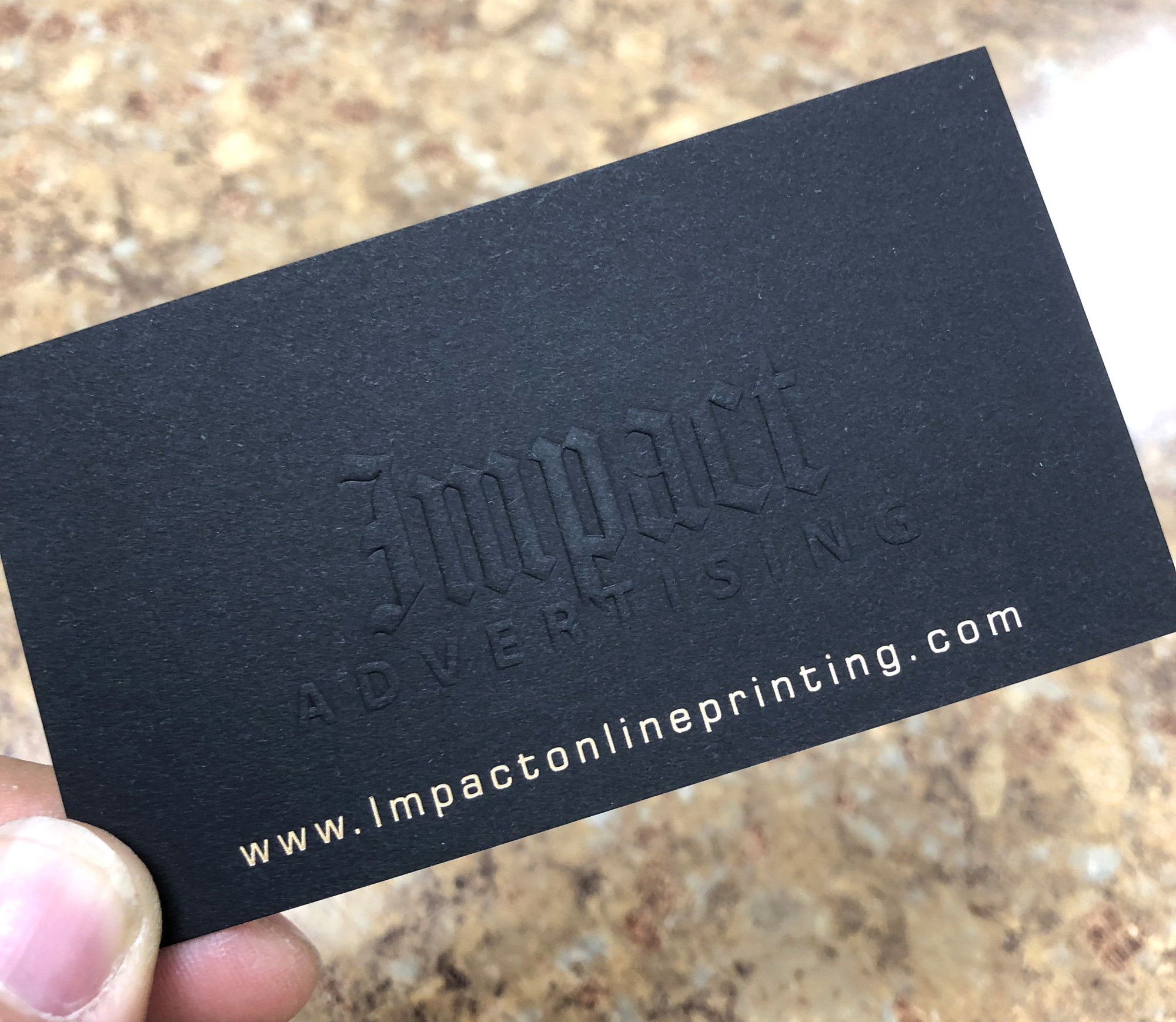 Embossed black business cards