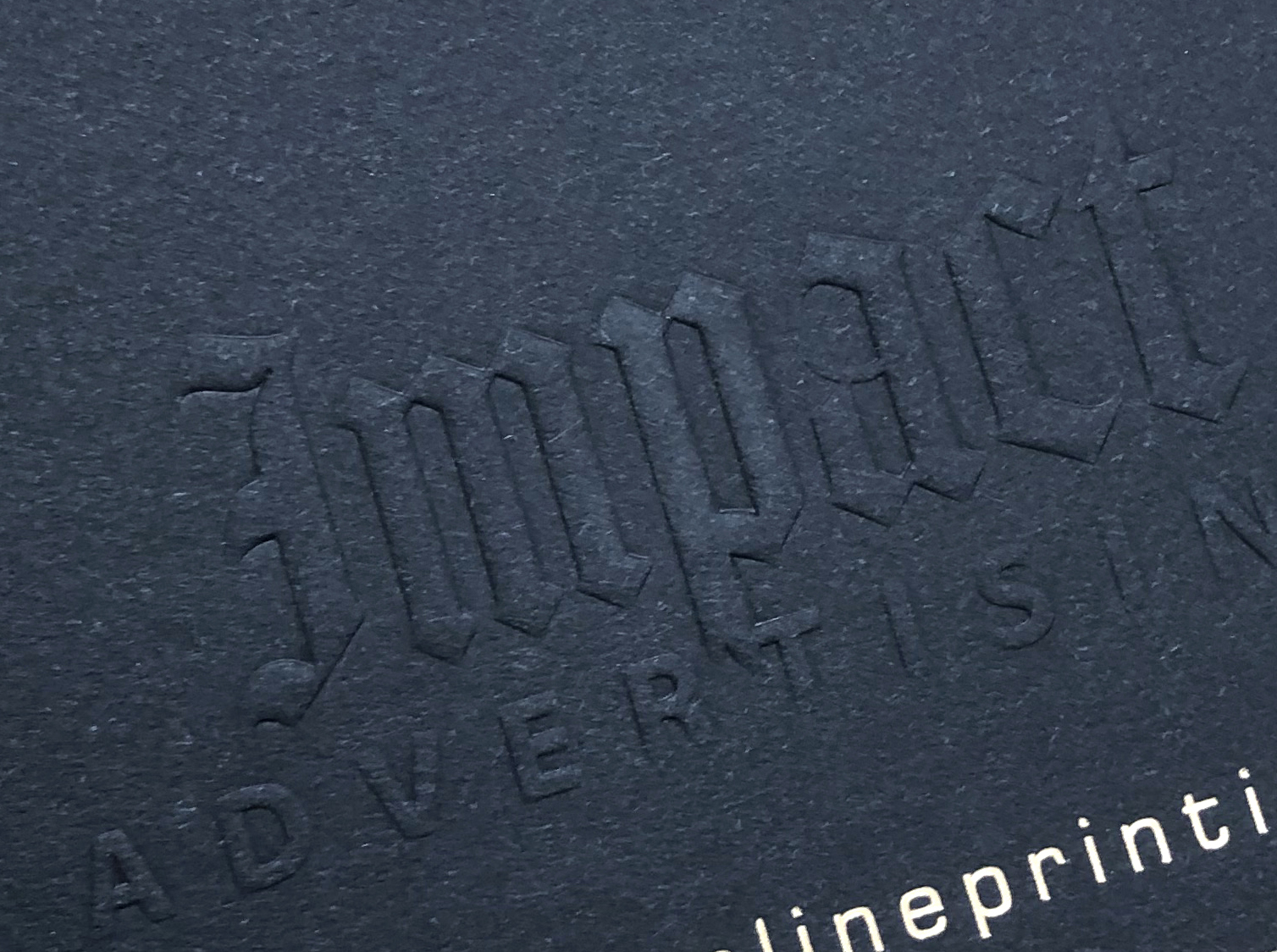 Embossed black business cards